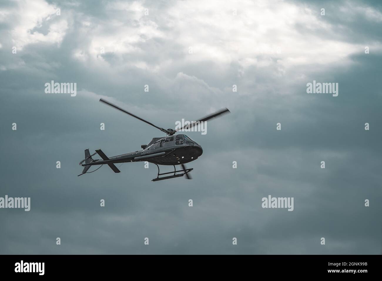 helicopter flying in a storm Stock Photo - Alamy
