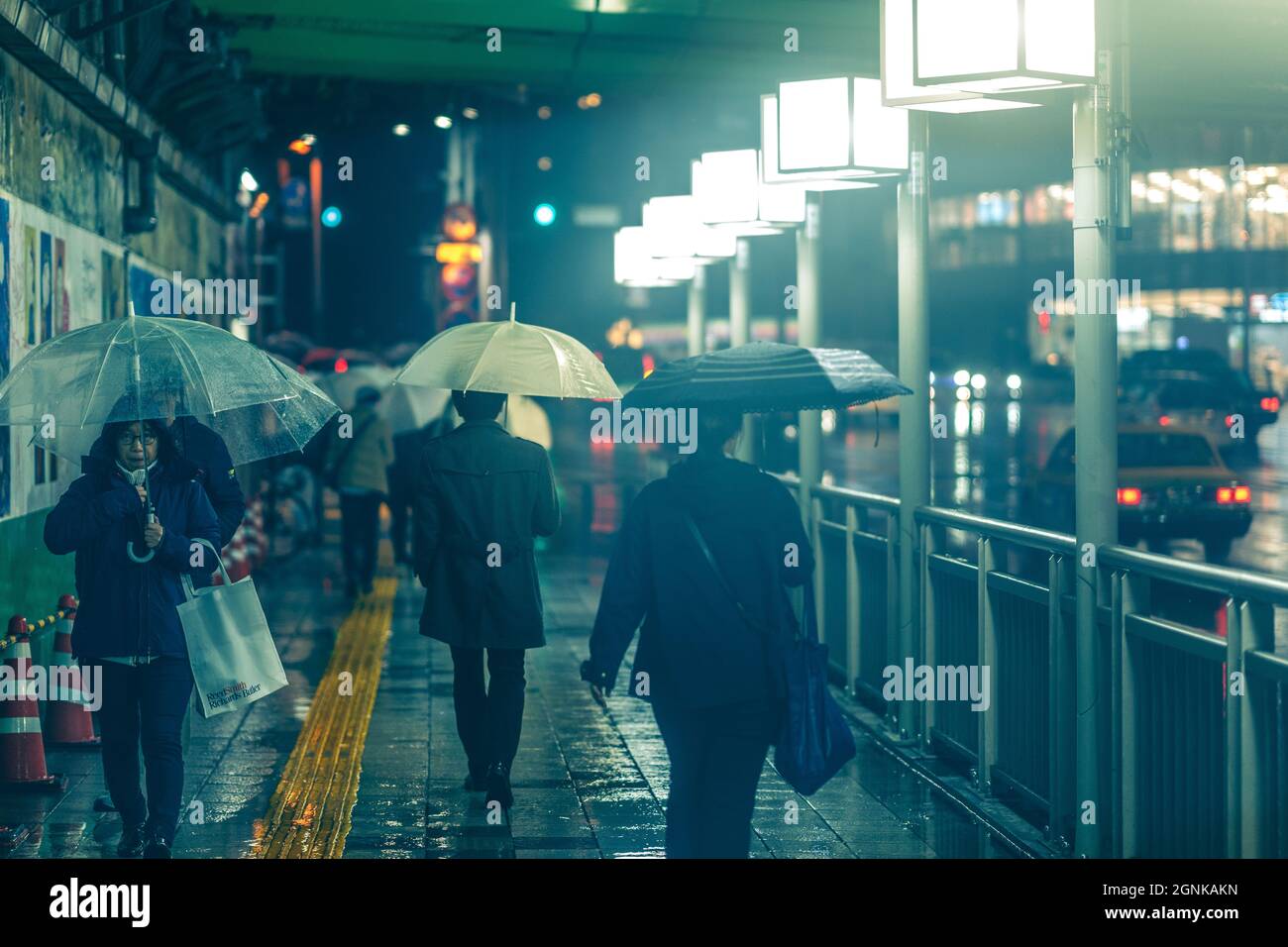 people walking at night in Japan Tokyo while its raining Stock Photo ...
