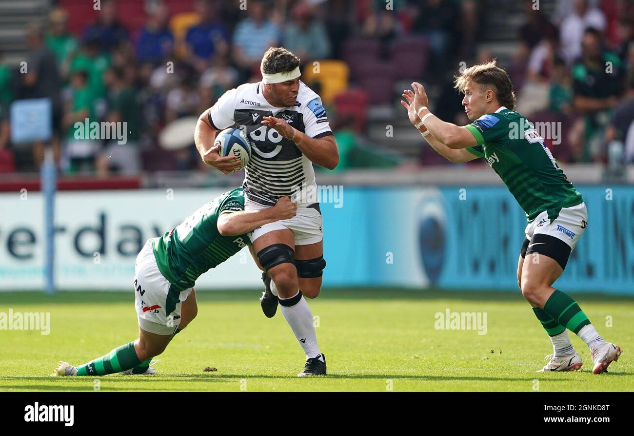 Sale Sharks' Jono Ross (centre) is tackled by London Irish's Matthew ...
