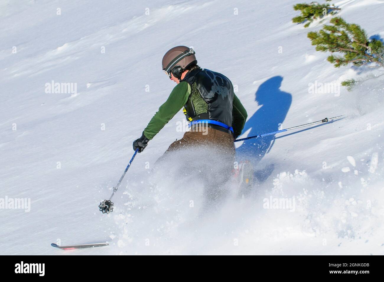 Freeskier skiing in backcountry with safety equipment Stock Photo - Alamy