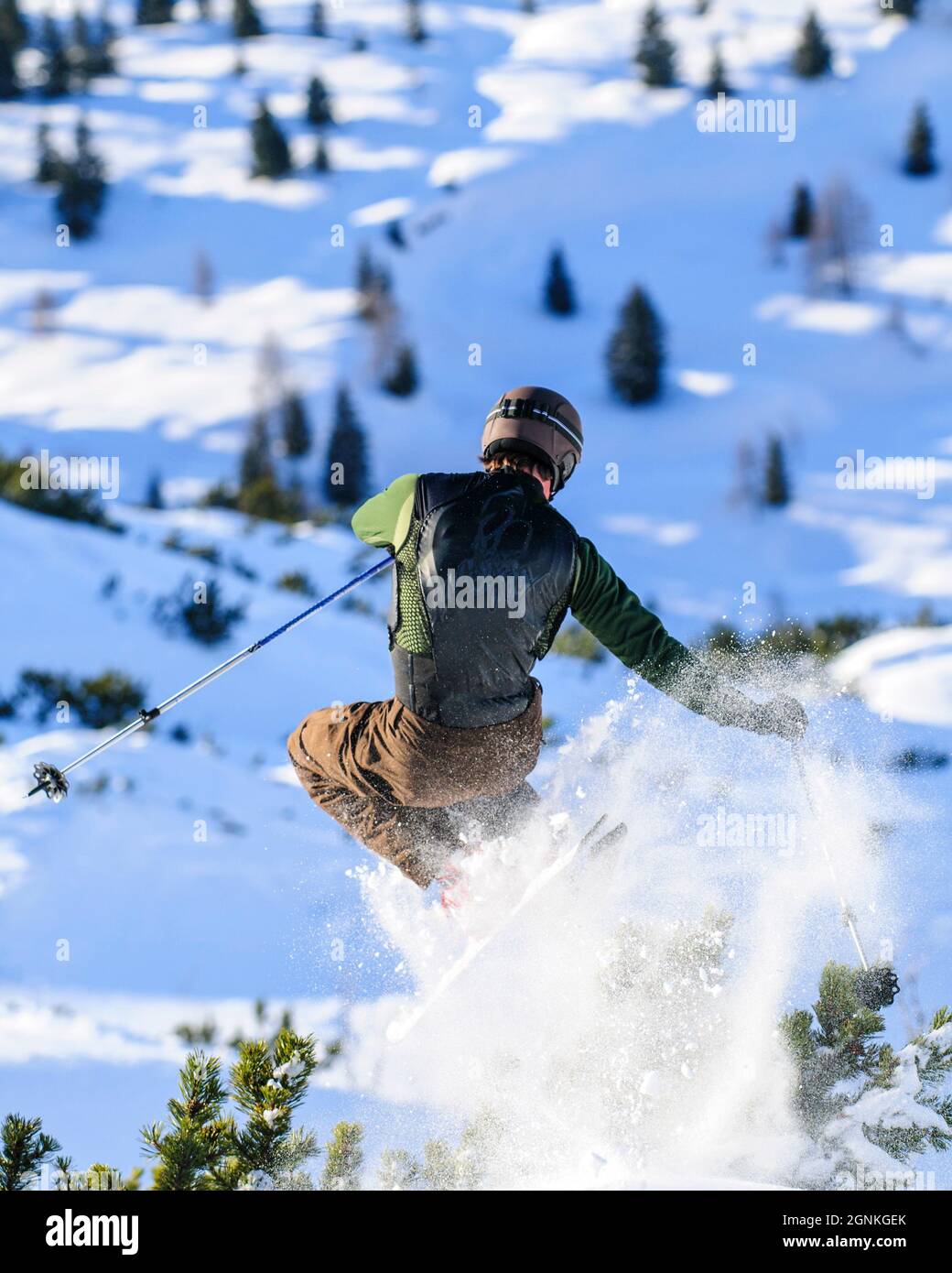 Freeskier skiing in backcountry with safety equipment Stock Photo - Alamy