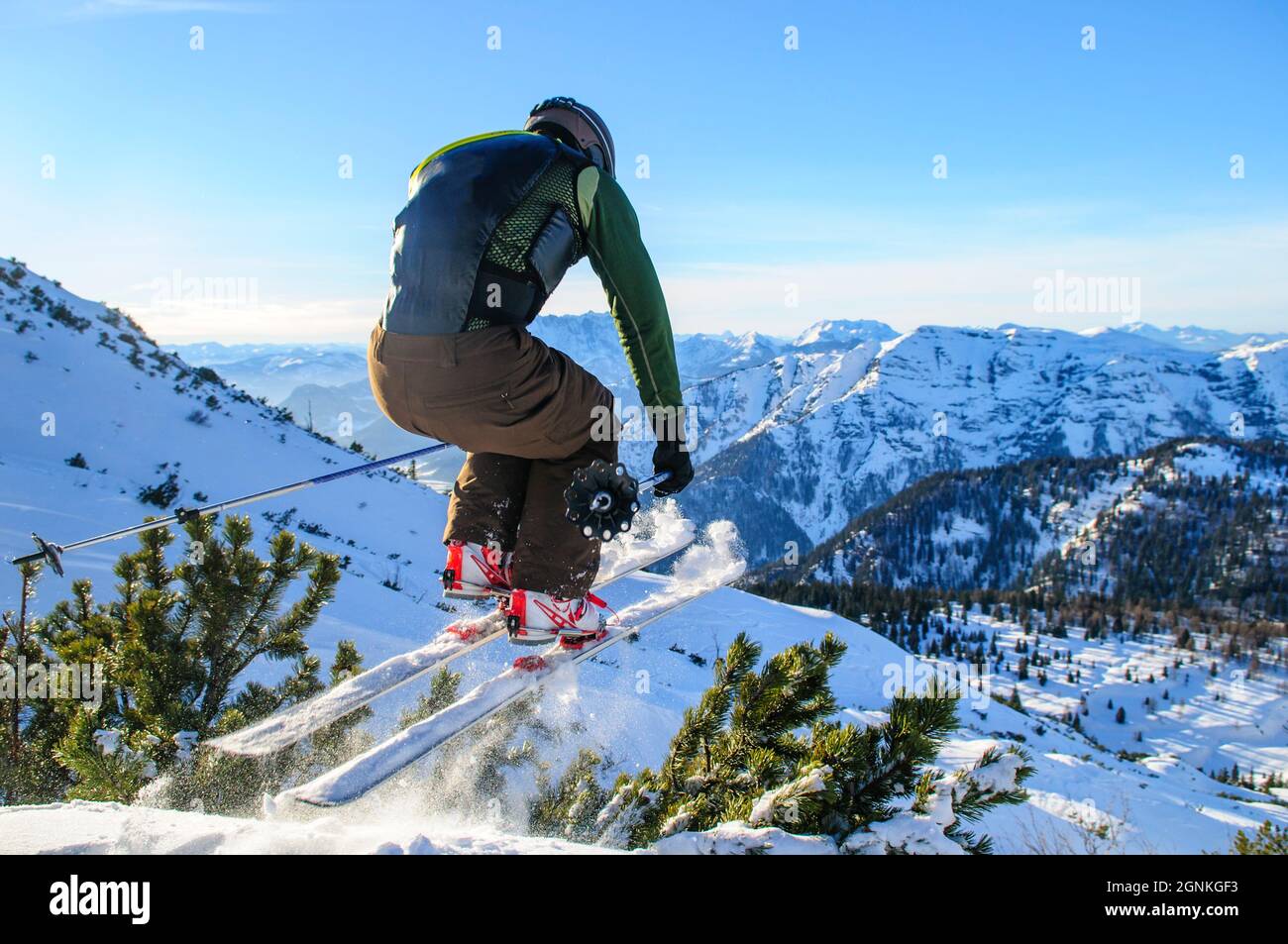 Freeskier skiing in backcountry with safety equipment Stock Photo - Alamy