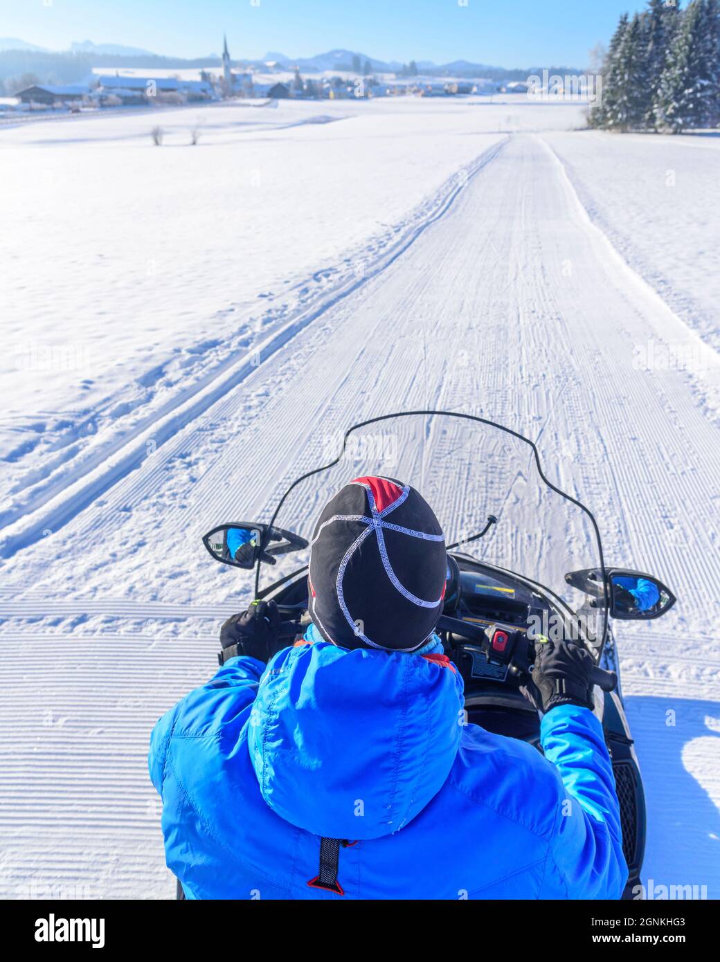 Preparation of cc-track with a skidoo and tracking Stock Photo - Alamy