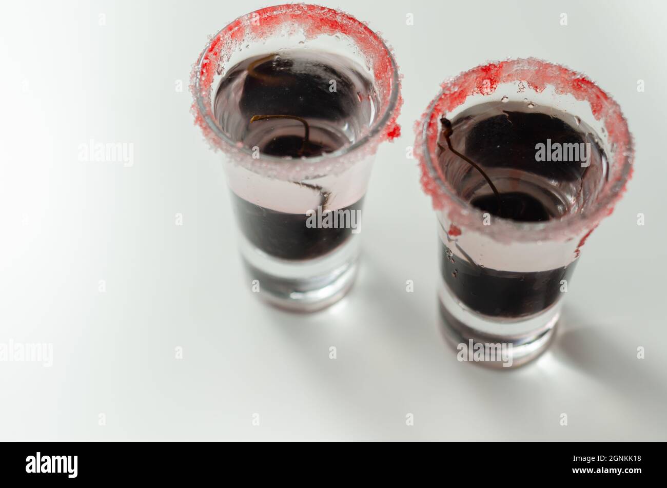 Drink based on vodka, transparent cherry liqueur and syrup in drink ...