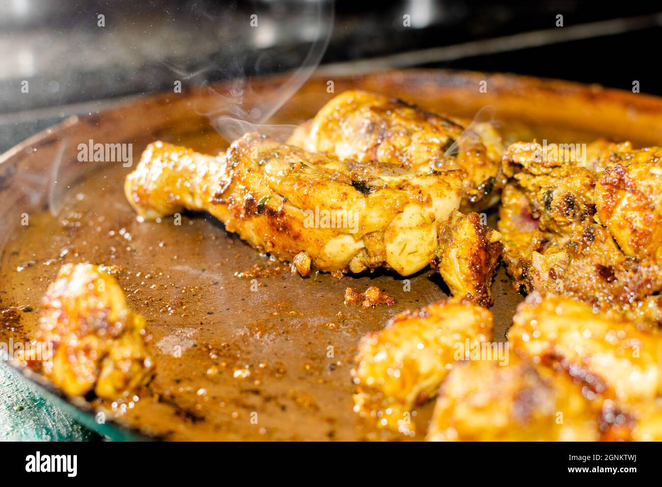 Marinated Chicken pieces kept in the hot pan to remove excess moisture ...