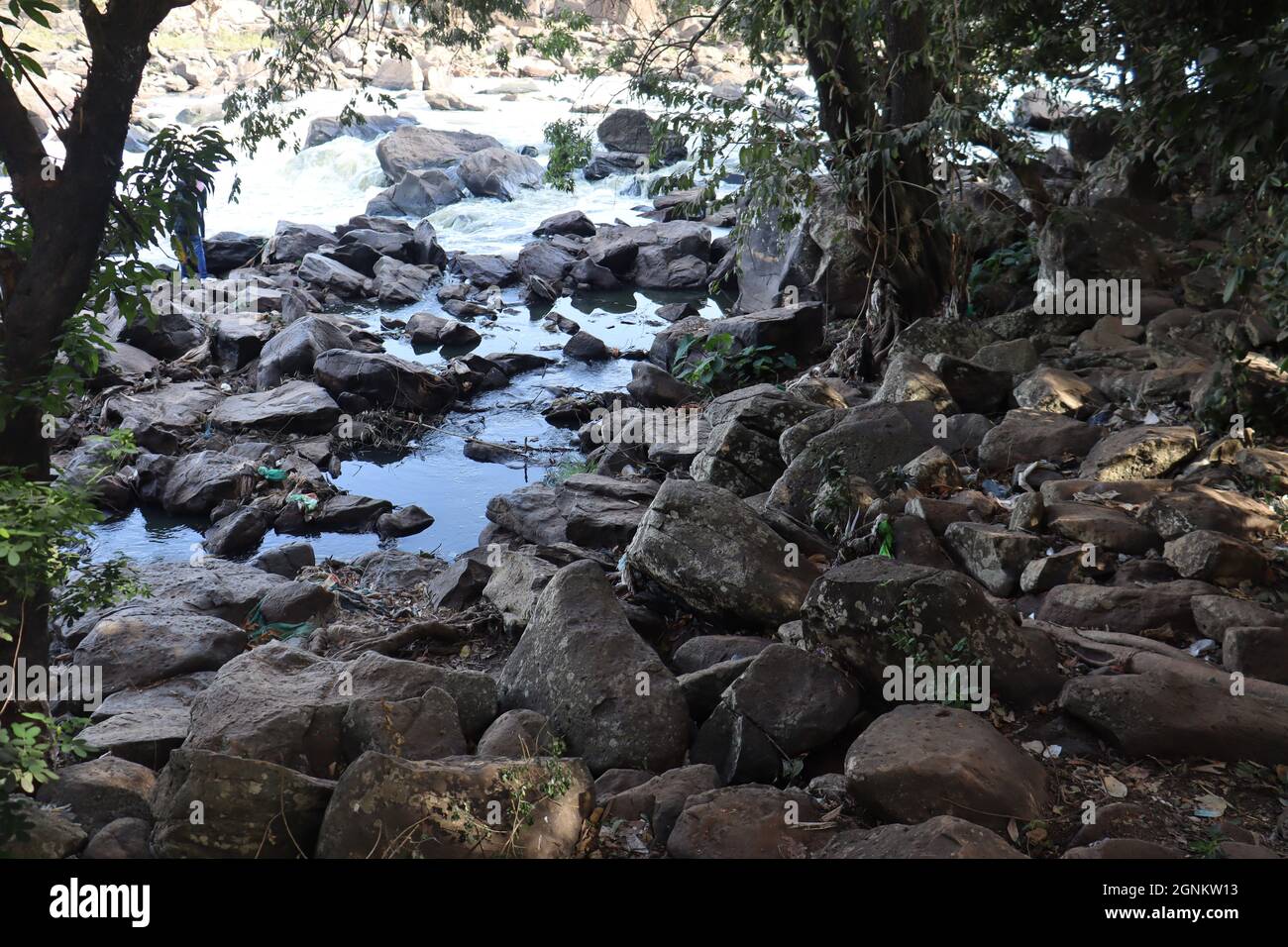 view of water on small rocks flows Stock Photo - Alamy
