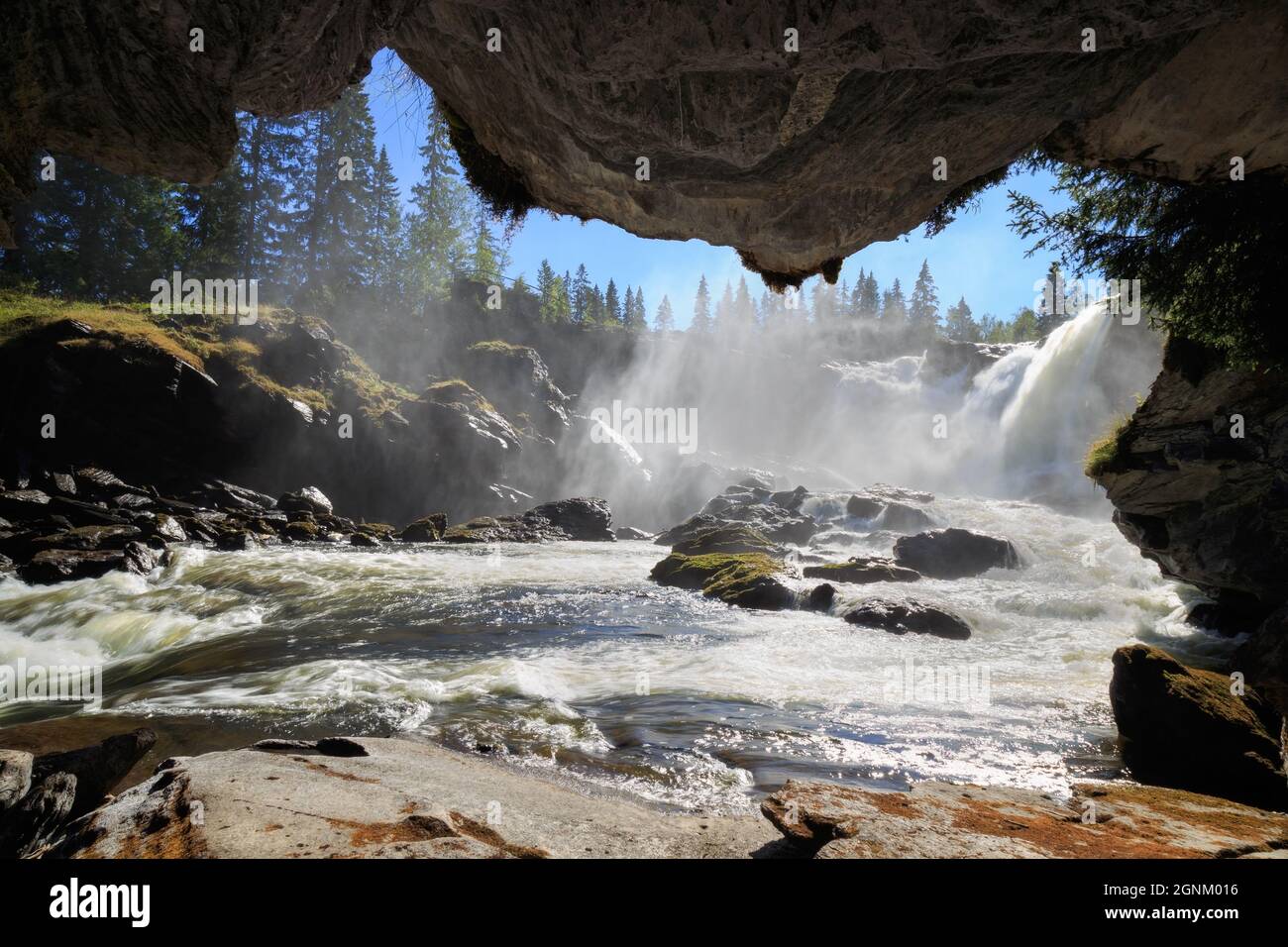 cave with waterfall in a summer landscape Stock Photo - Alamy