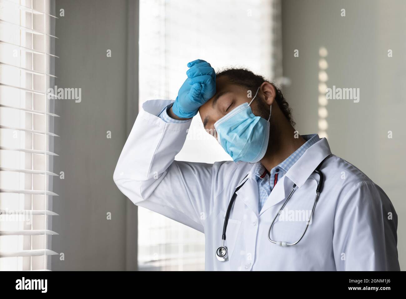 Exhausted doctor feeling fatigue due to work in covid hospital Stock ...