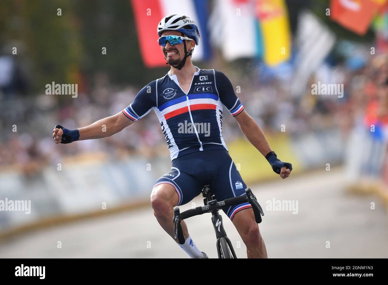French Julian Alaphilippe celebrates as he crosses the finish line to ...