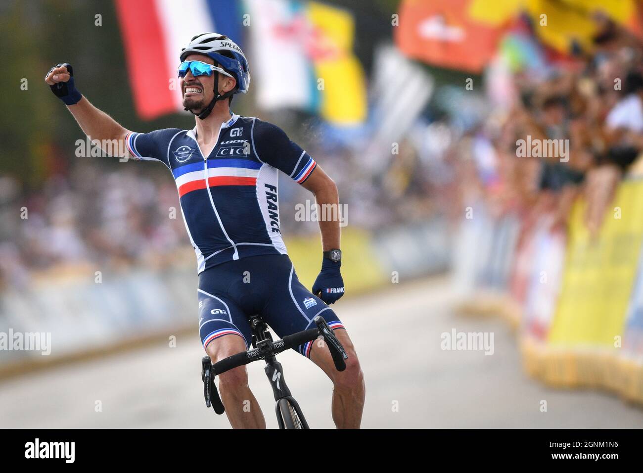 French Julian Alaphilippe celebrates as he crosses the finish line to ...
