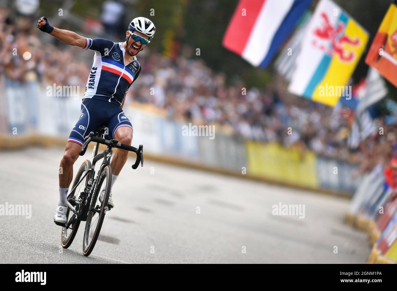 French Julian Alaphilippe celebrates as he crosses the finish line to ...