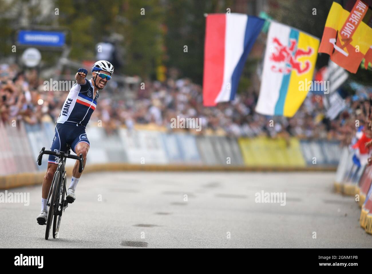 French Julian Alaphilippe celebrates as he crosses the finish line to ...