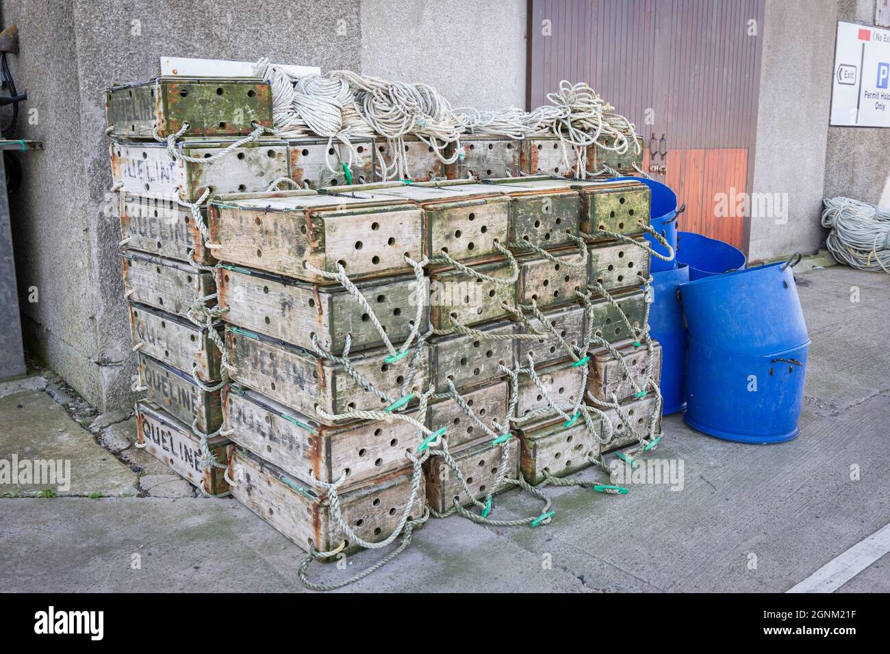 Wooden boxes with holes at a fishing port Stock Photo - Alamy
