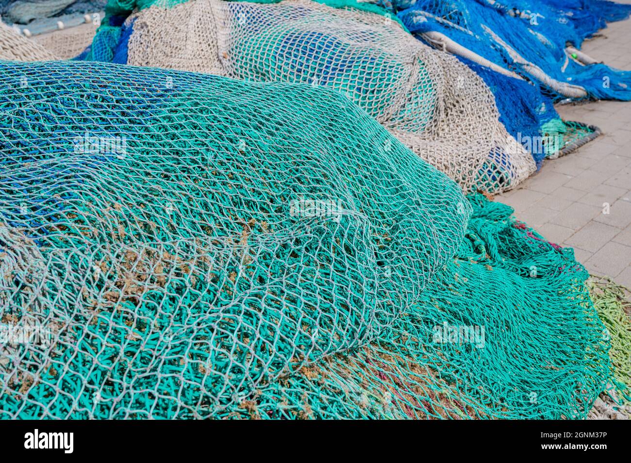 stack of fishing nets in the sunshine Stock Photo - Alamy