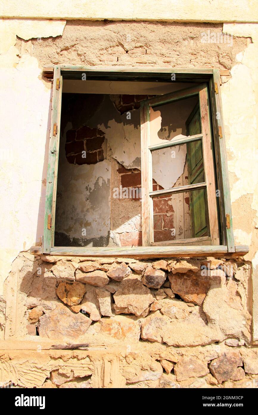 Broken and damaged window in an old house in Spain Stock Photo - Alamy
