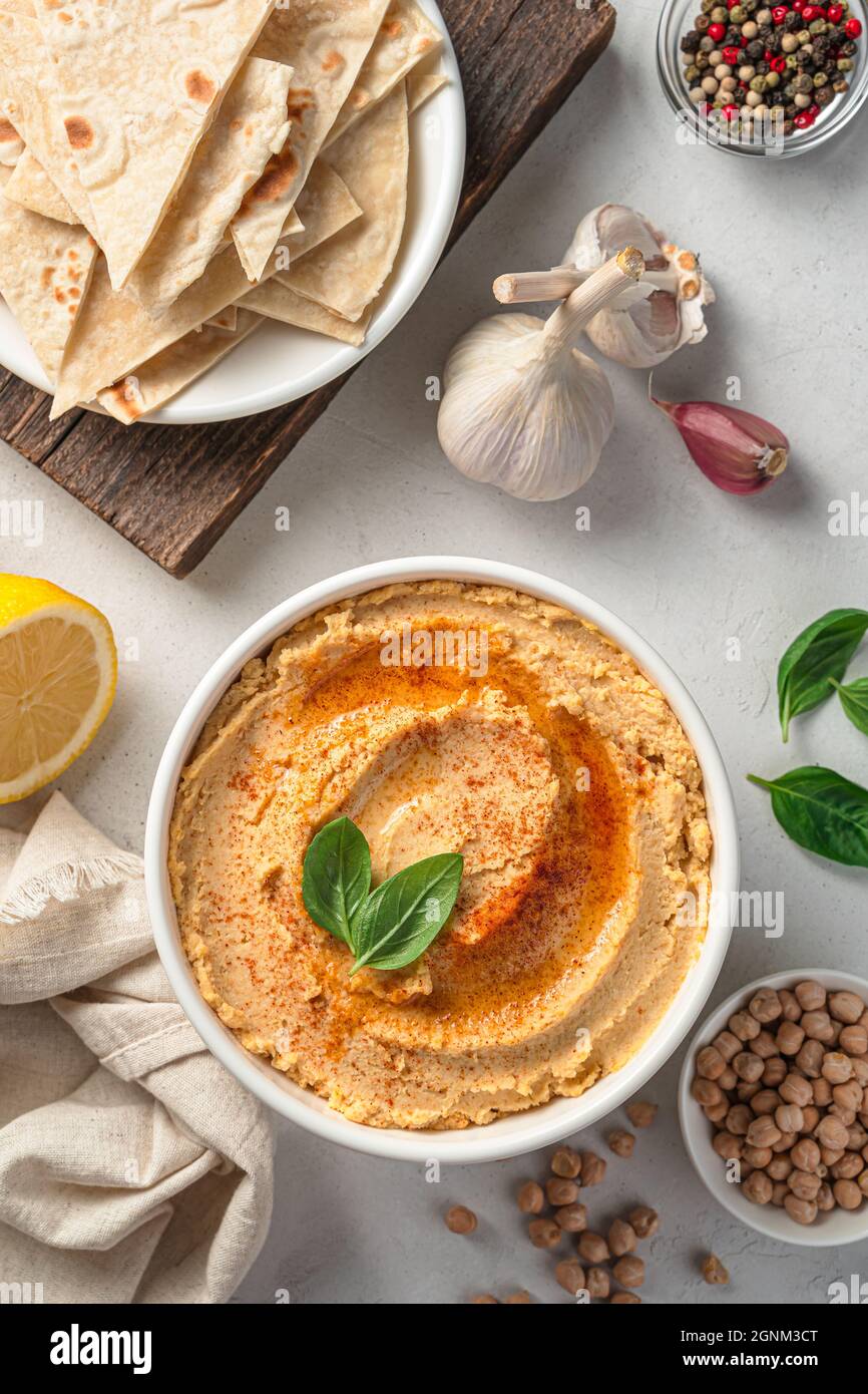Oriental hummus and ingredients on a gray background. Top view ...