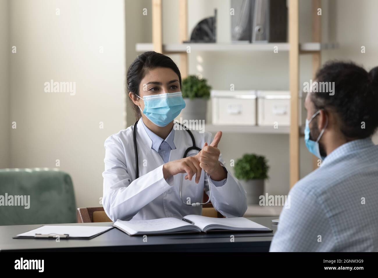 Indian doctor patient mask hi-res stock photography and images - Alamy