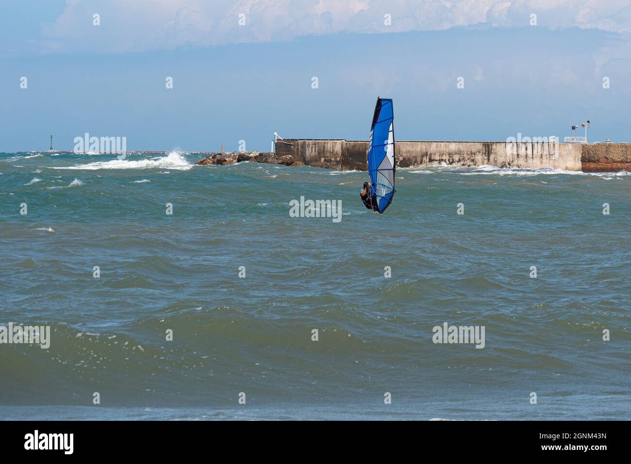 Windsurf Riding the Waves in a Choppy Sea Stock Photo - Alamy
