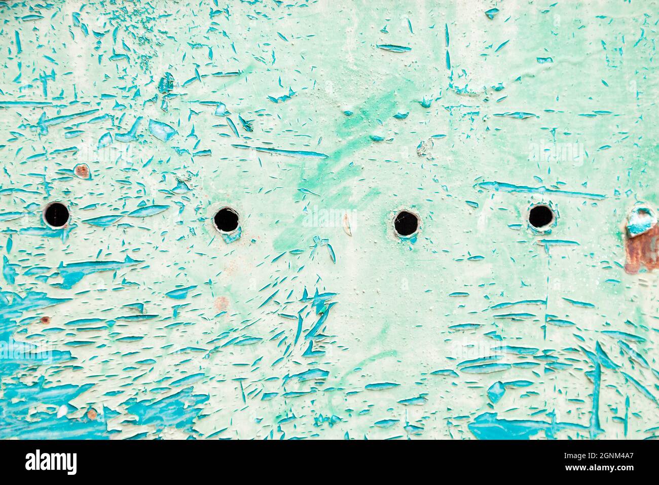 rusty and scratched metal panel background with four holes Stock Photo ...