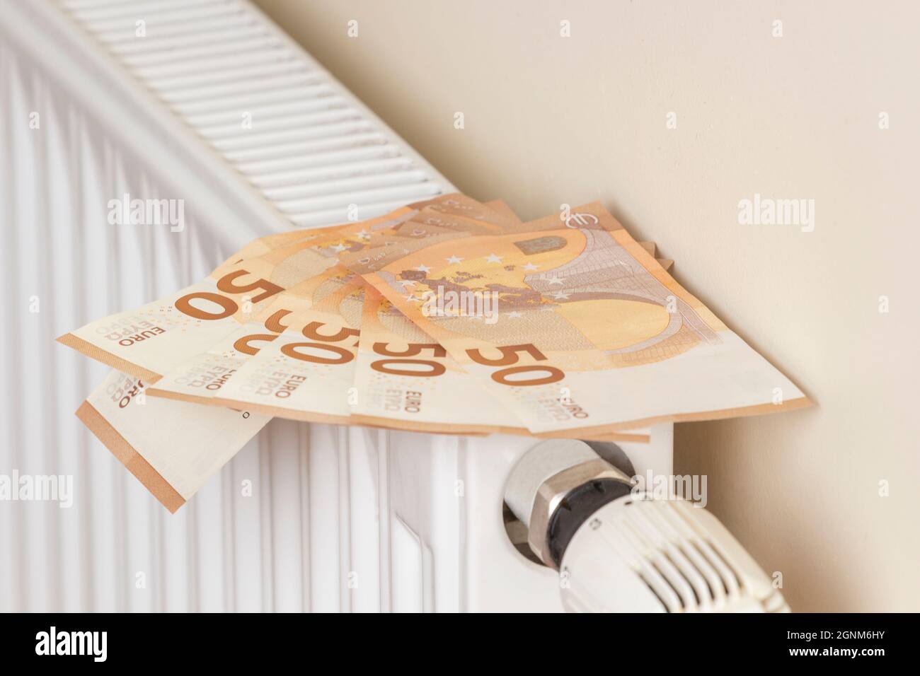 Expensive heating costs. Paying bills. Euro money banknotes on heating ...