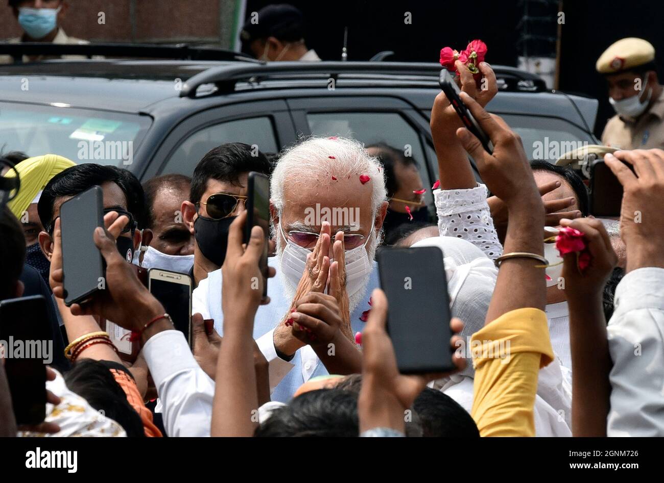 NEW DELHI, INDIA – SEPTEMBER 26: Prime Minister Narendra Modi gestures at supporters upon his ...