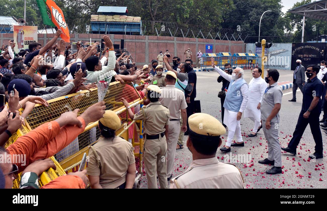 NEW DELHI, INDIA – SEPTEMBER 26: Prime Minister Narendra Modi waves at supporters upon his ...