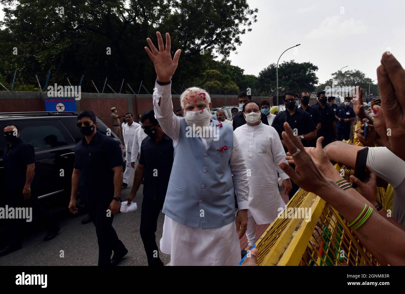 NEW DELHI, INDIA – SEPTEMBER 26: Prime Minister Narendra Modi waves at supporters upon his ...