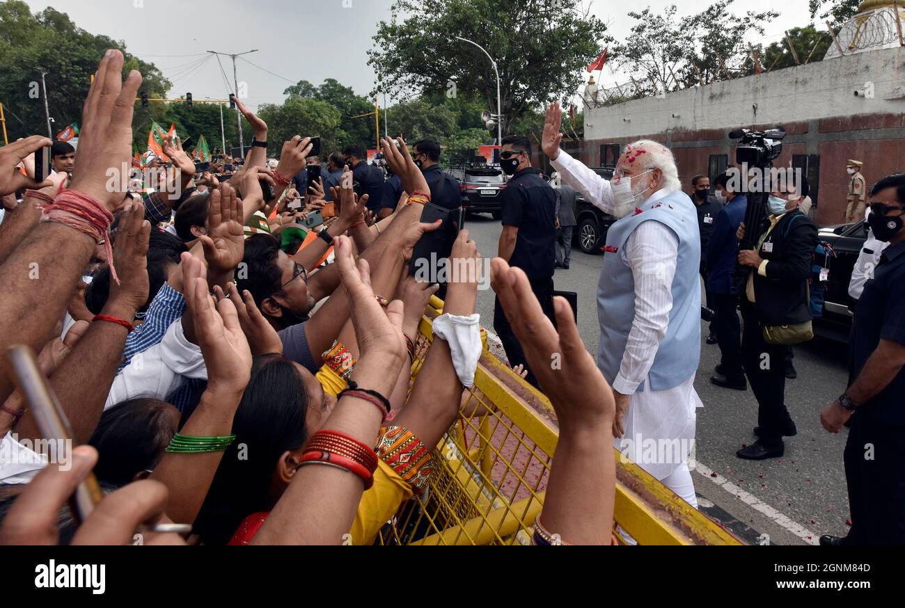 NEW DELHI, INDIA – SEPTEMBER 26: Prime Minister Narendra Modi waves at supporters upon his ...