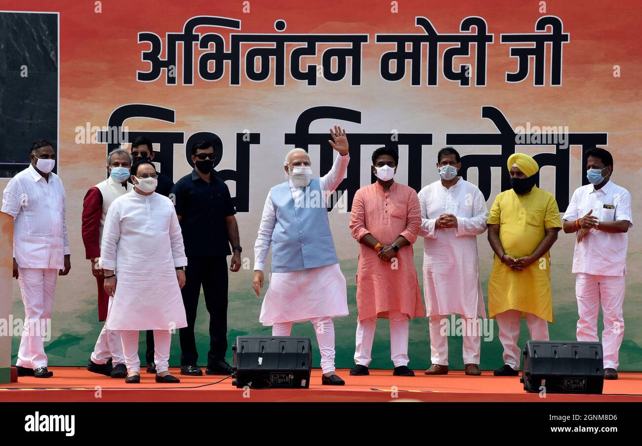 NEW DELHI, INDIA - SEPTEMBER 26: Prime Minister Narendra Modi waves at ...