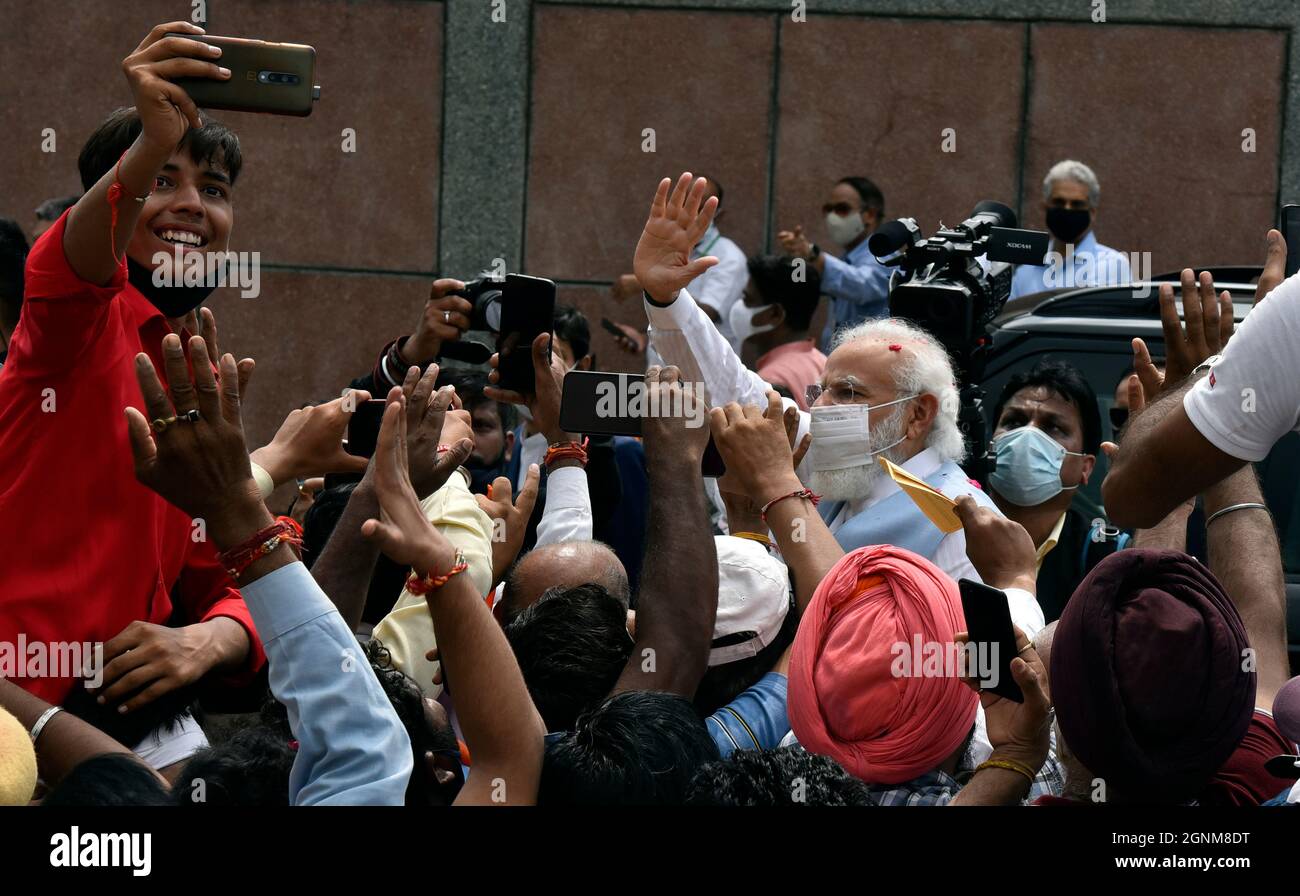 NEW DELHI, INDIA - SEPTEMBER 26: Prime Minister Narendra Modi waves at supporters upon his ...