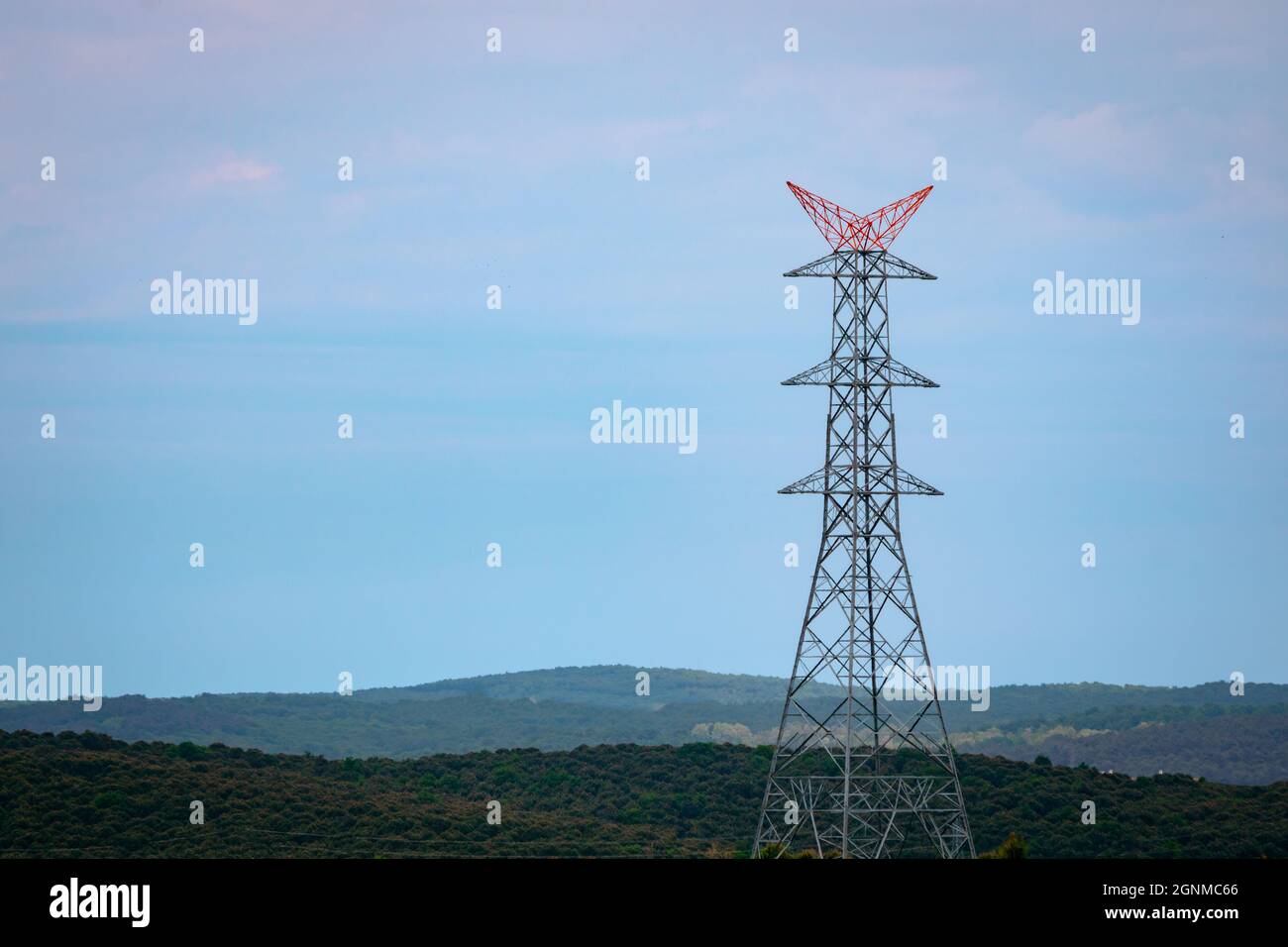 Newly built electricty pylon in the forest. Electric grid background ...