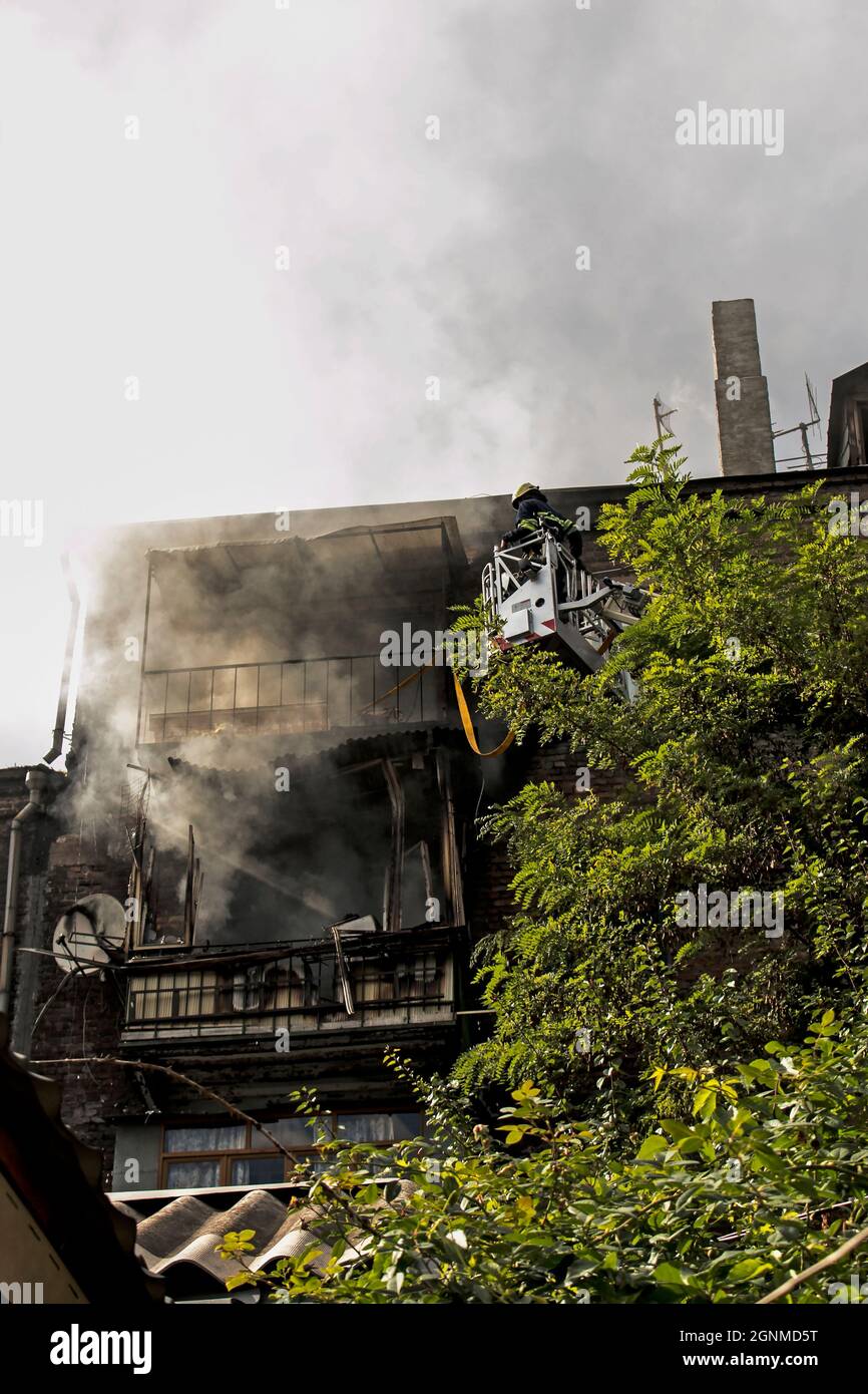 Fire in a residential five-story building. View of the burned-out ...