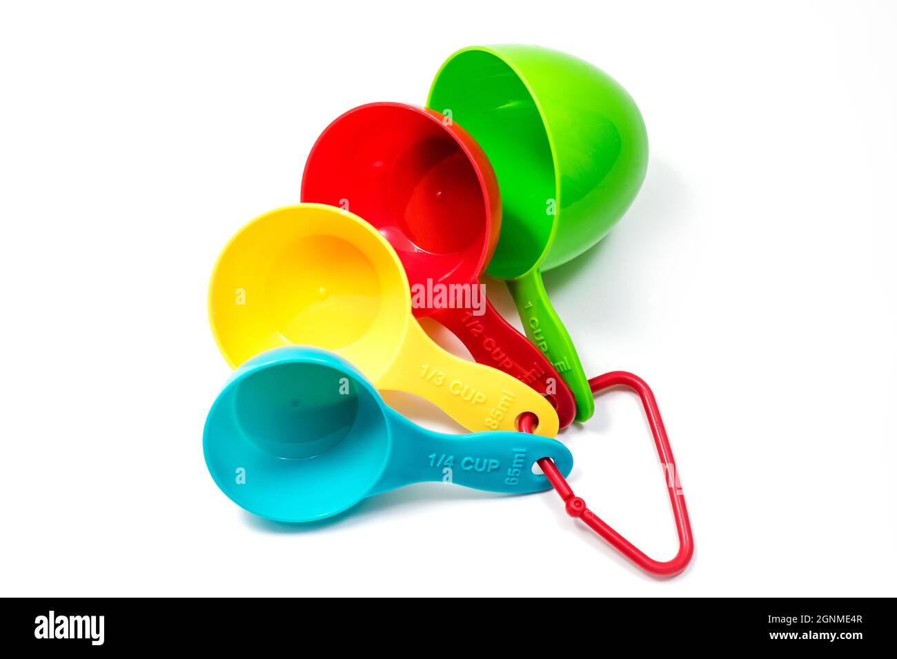 Four pieces of colorful ingredient measuring scoops or spoons of ...
