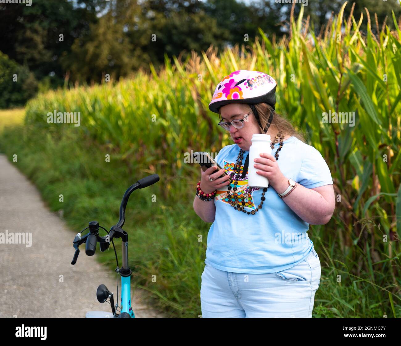 White woman with Down Syndrome calling her family with a smartphone ...