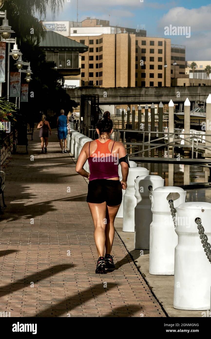 Female exercising 0n Channelside Walk Way, Harbor Island, Tampa, Fl ...