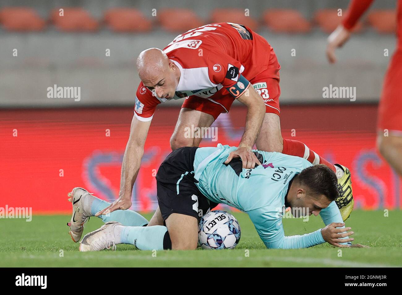 Mouscron's Christophe Lepoint and Westerlo's Erdon Daci fight for the ...