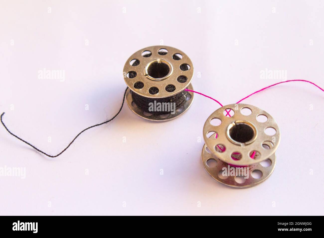 sewing machine steel yarn, bobbin for thread on white background Stock ...