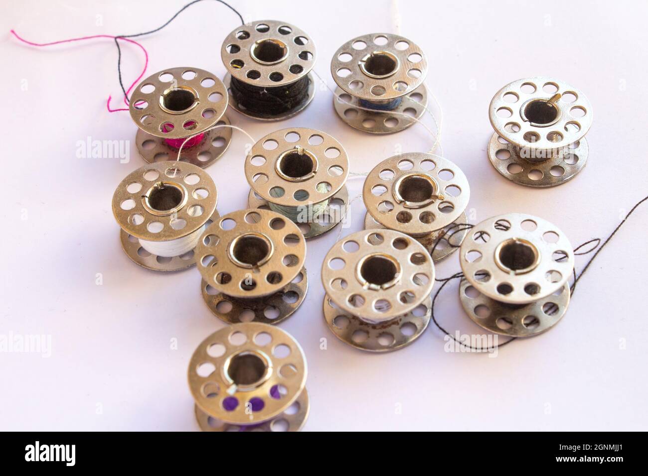 sewing machine steel yarn, bobbin for thread on white background Stock ...