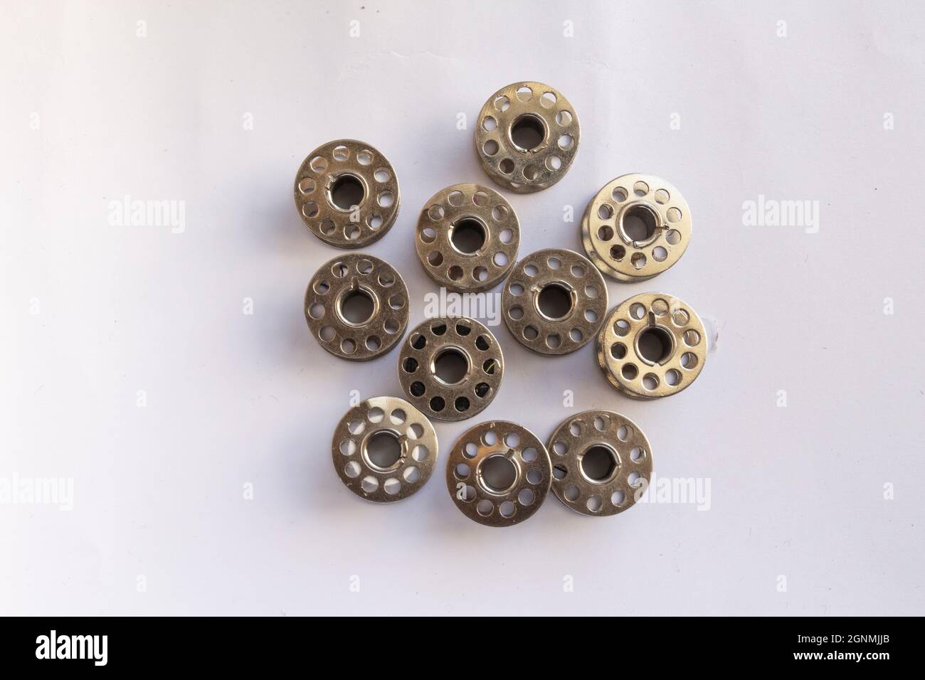 sewing machine steel yarn, bobbin for thread on white background Stock ...