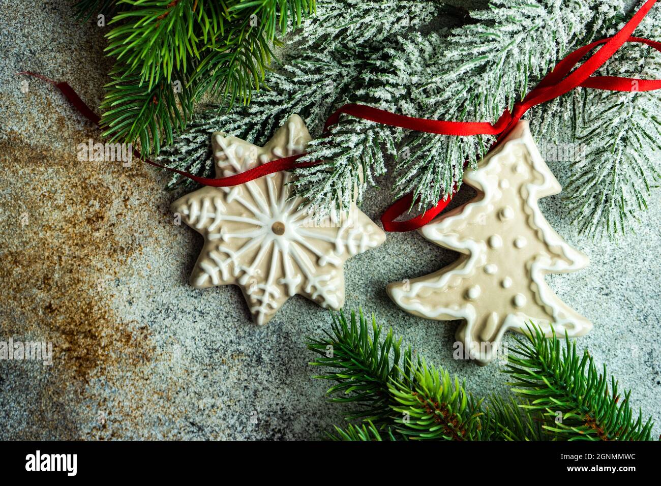 Christmas frame with ceramic gingerbread cookies on concrete background ...