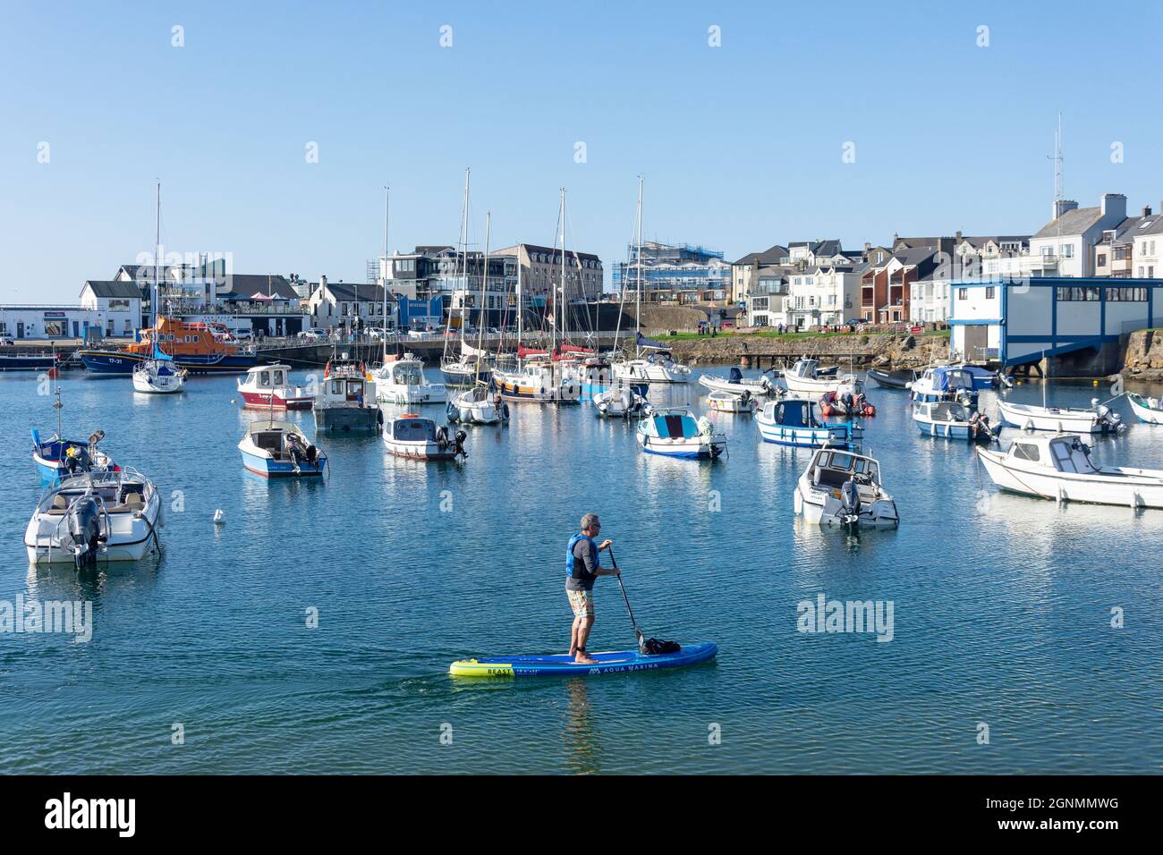 Man paddleboarding in Portrush Harbour, Portrush (Port Rois), County ...