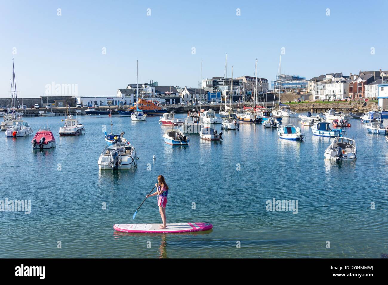 Young woman paddleboarding in Portrush Harbour, Portrush (Port Rois ...