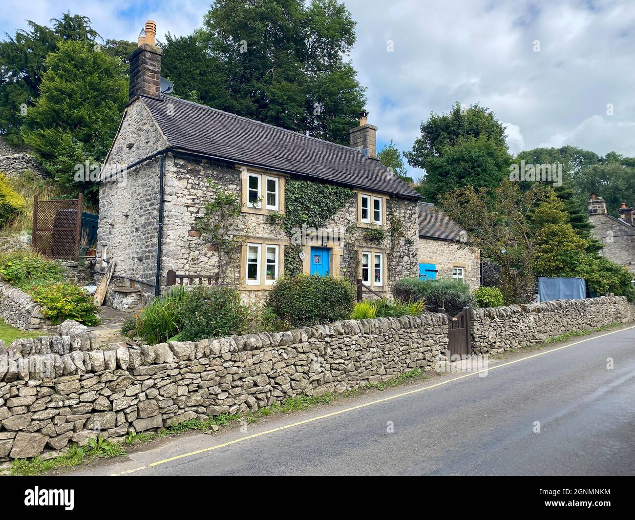 Typical block built traditional cottage in Hartington village in the ...