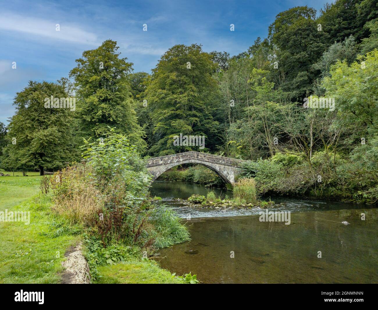 Bridge over the River Manifold at Ilam Park, Derbyshire, UK Stock Photo ...