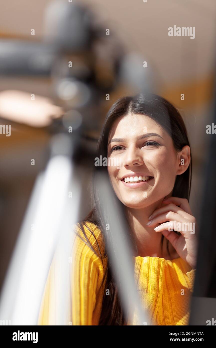 Beautiful girl talking in front of a camera, recording herself. Video ...