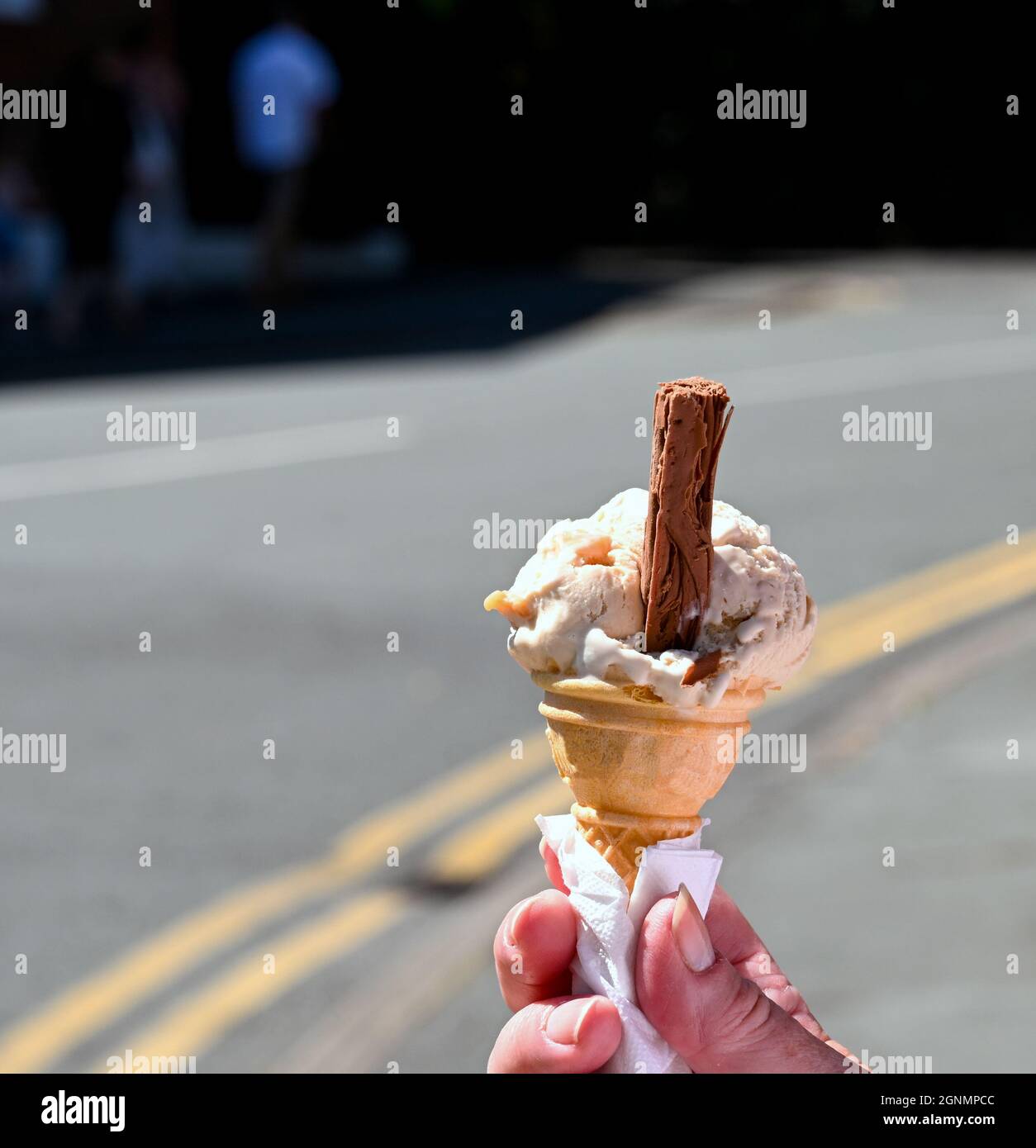 Ice cream cone with a chocolate stick Stock Photo - Alamy