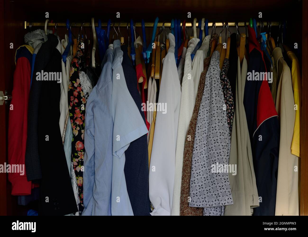 a lot of old different clothes in the wardrobe Stock Photo - Alamy