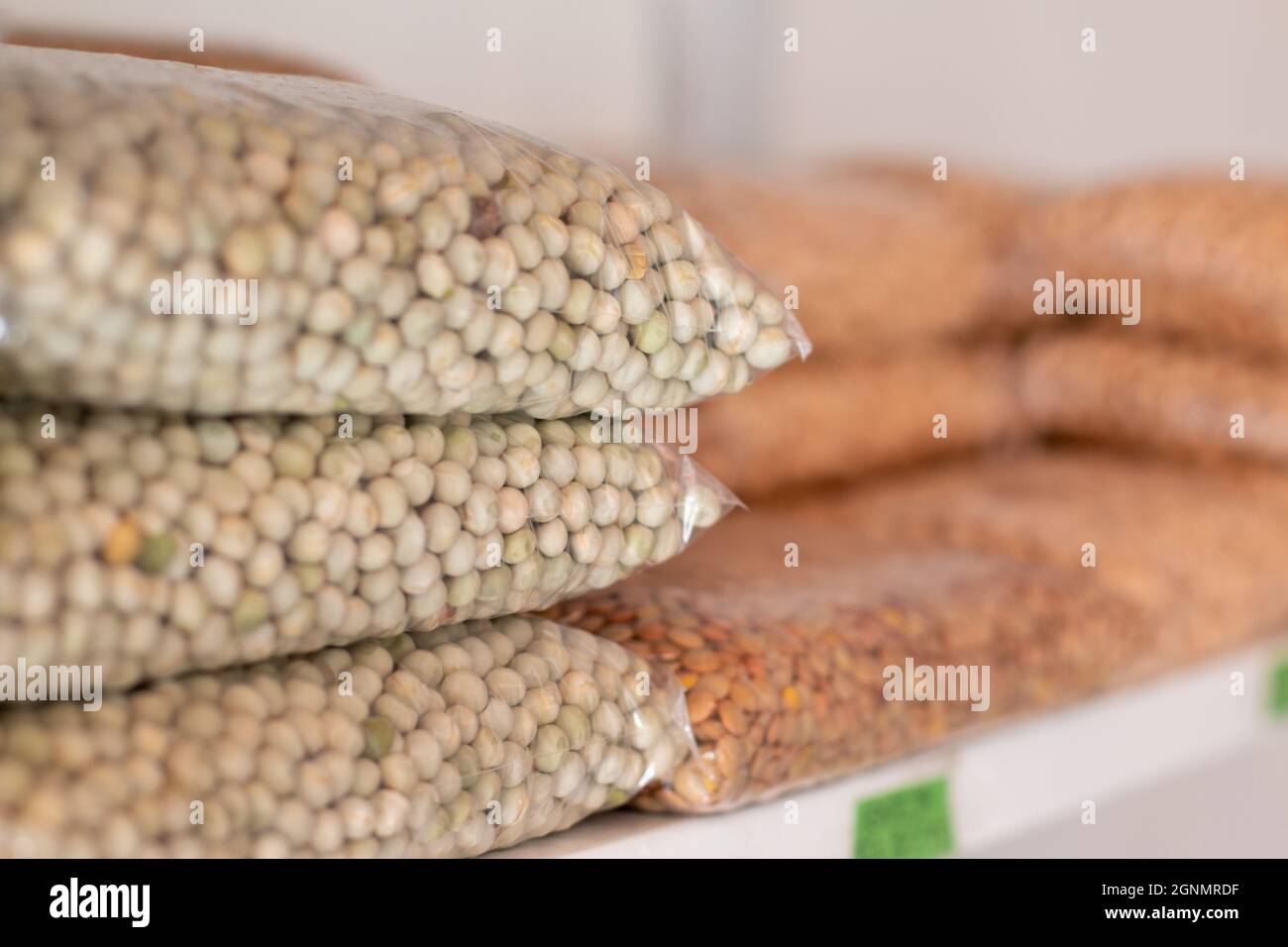 Peas. Transparent bags of peas on shelf. grain store. Agricultural ...