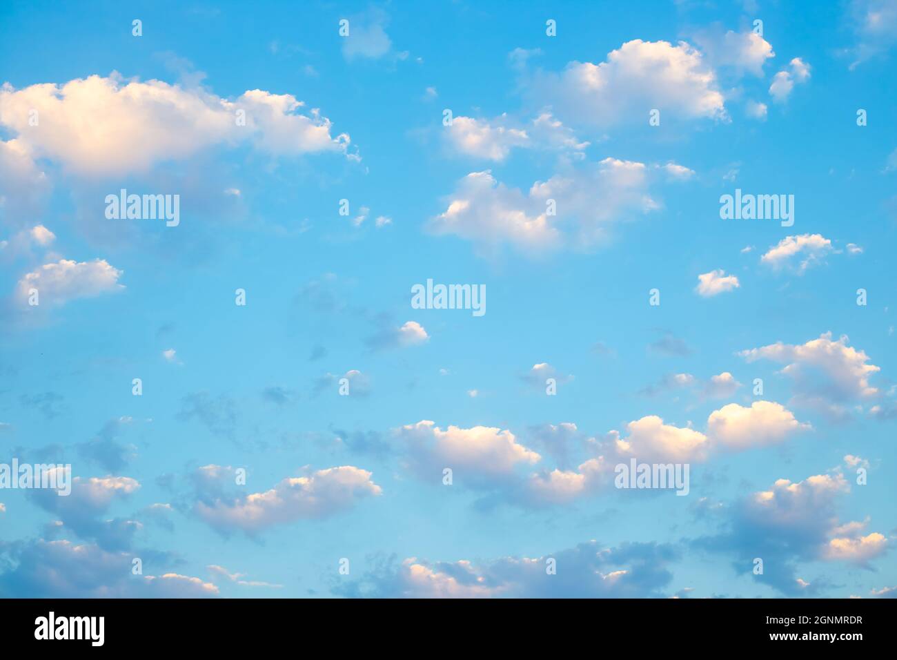 Blue sky with white sun-lit clouds. Natural airy background, pattern ...