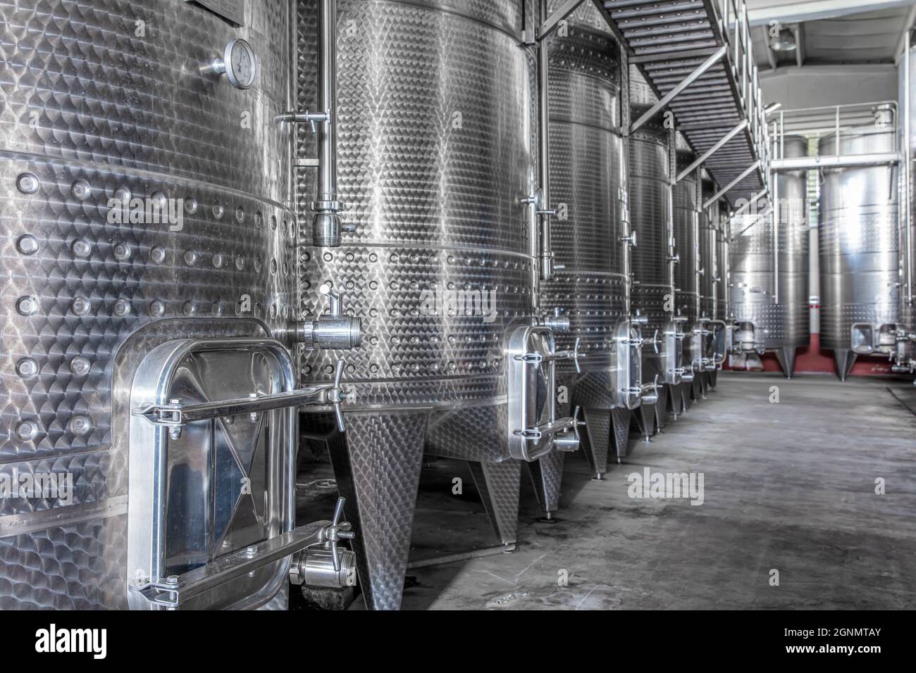 Steel wine tanks for wine fermentation at a winery. modern wine factory ...